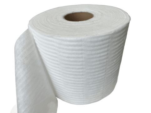 Close-up detail of a jumbo roll of white spunlace nonwoven fabric with ...